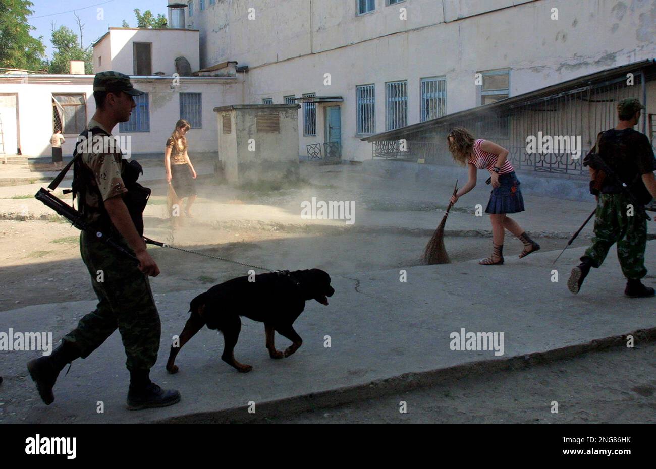 Russian soldiers from a combat engineer unit with a bomb-sniffing dog ...