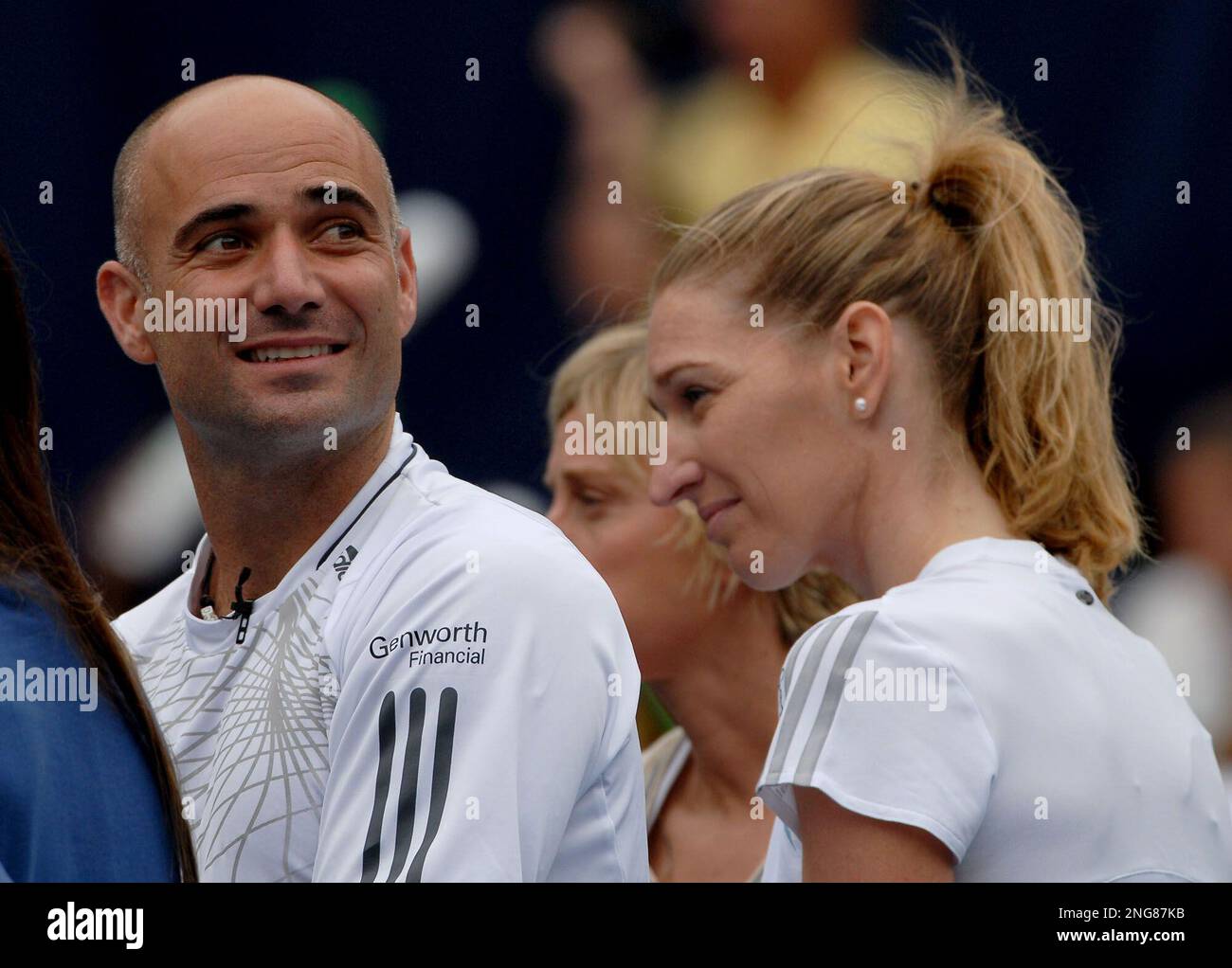 Tennis greats Andre Agassi, left, and his wife Steffi Graf take part in ...