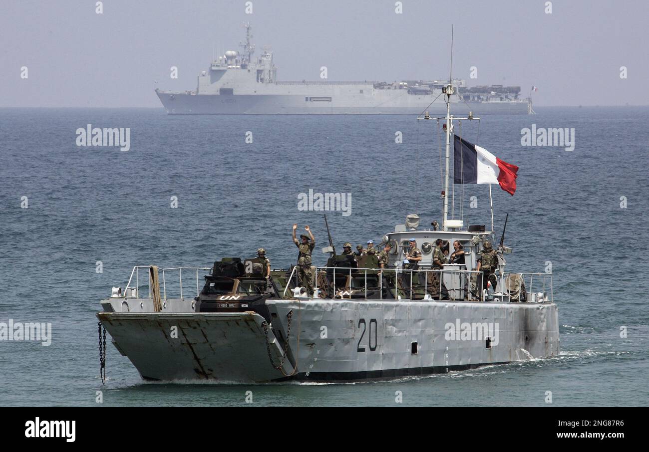 Backdropped by French Navy ship The Mistral, a French landing vessel ...