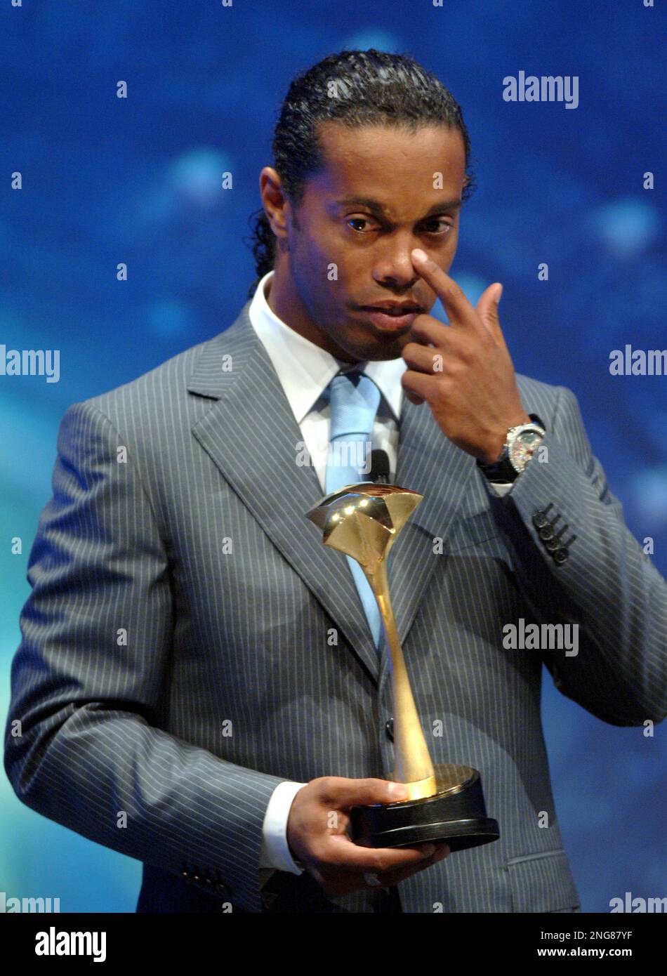 FC Barcelona's Brasilian forward Ronaldinho receives the best player of ...