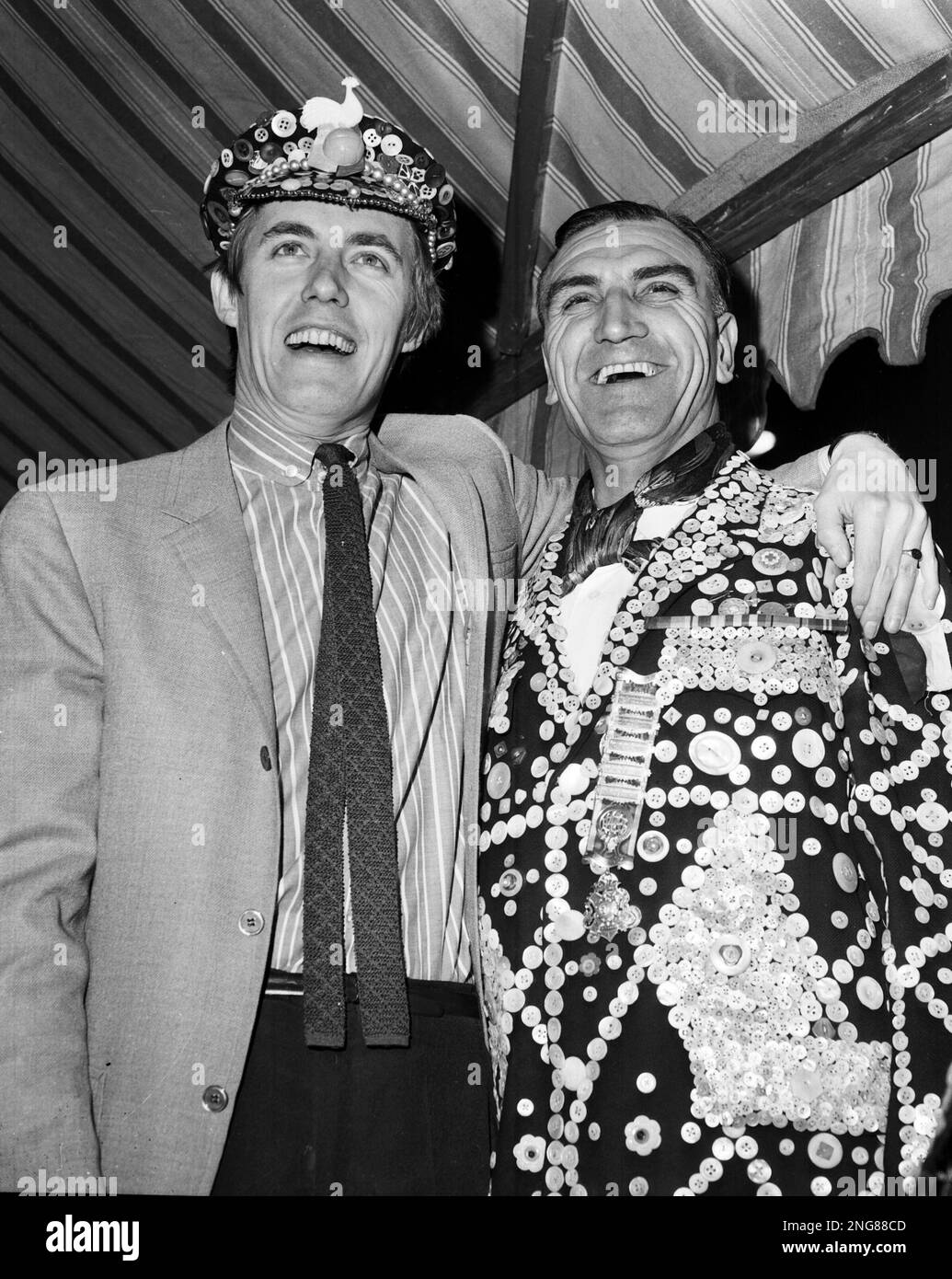 Television personality and disc jockey Simon Dee, left, jokingly puts ...