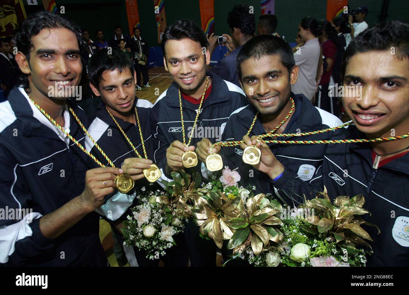 Indian table tennis team members pose with their gold medals after ...