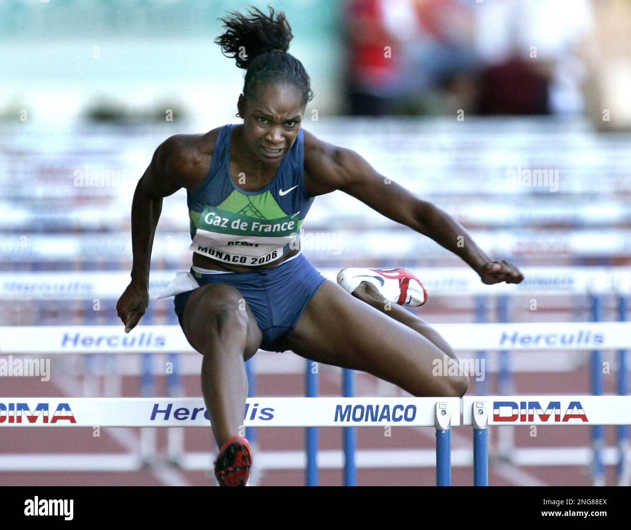 Michele Perry of the United States runs to win the Women's 100 meters ...