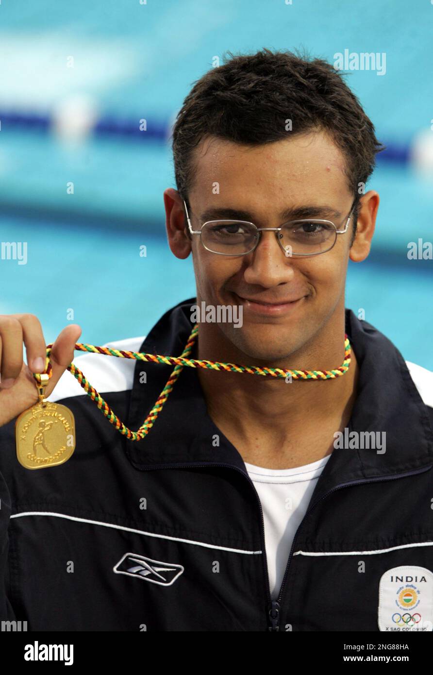 India's gold winner Rehan Poncha poses after the medals ceremony of the ...