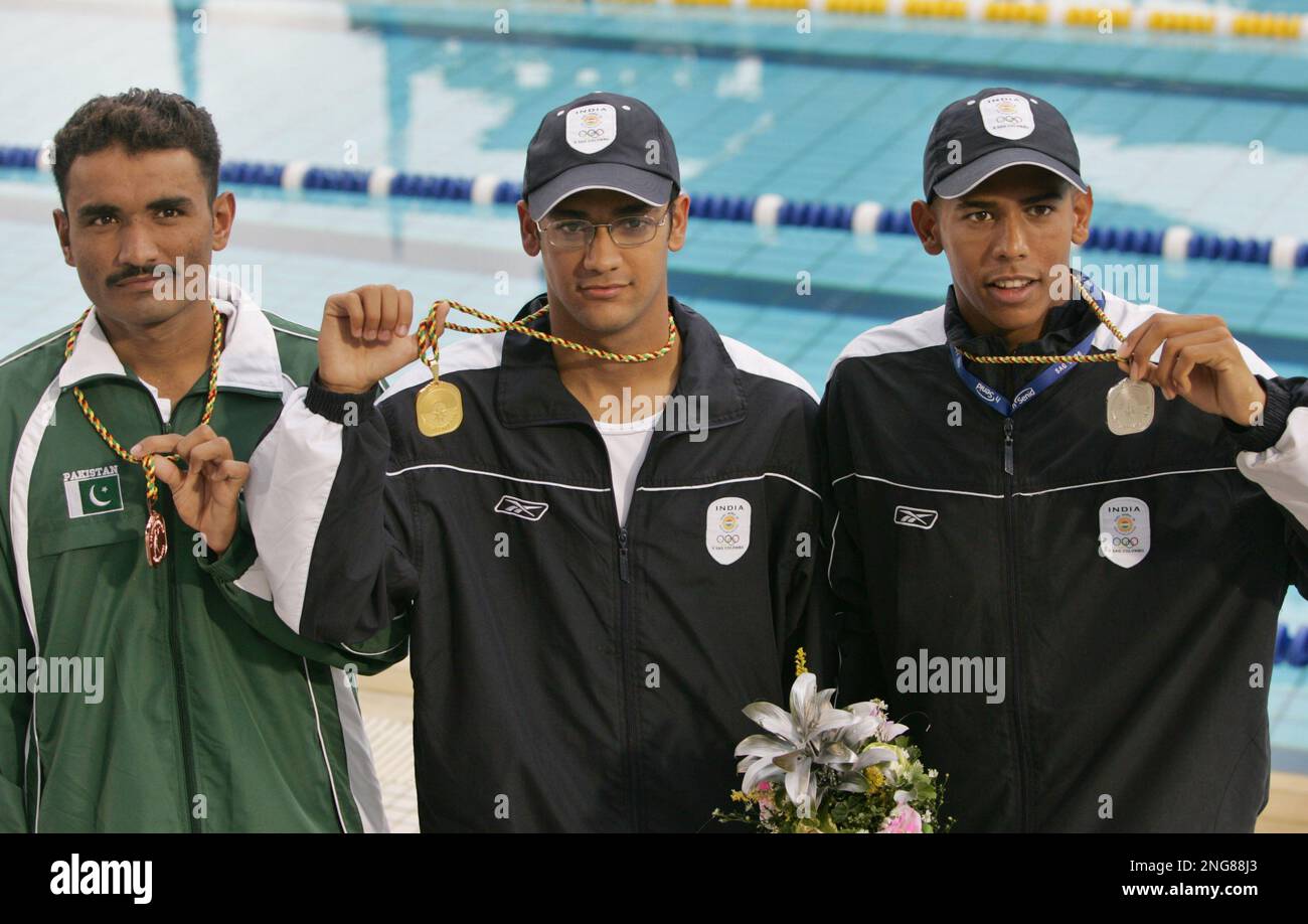 Gold winner Indias Rehan Poncha, center, silver winner Rohit Havaldar ...