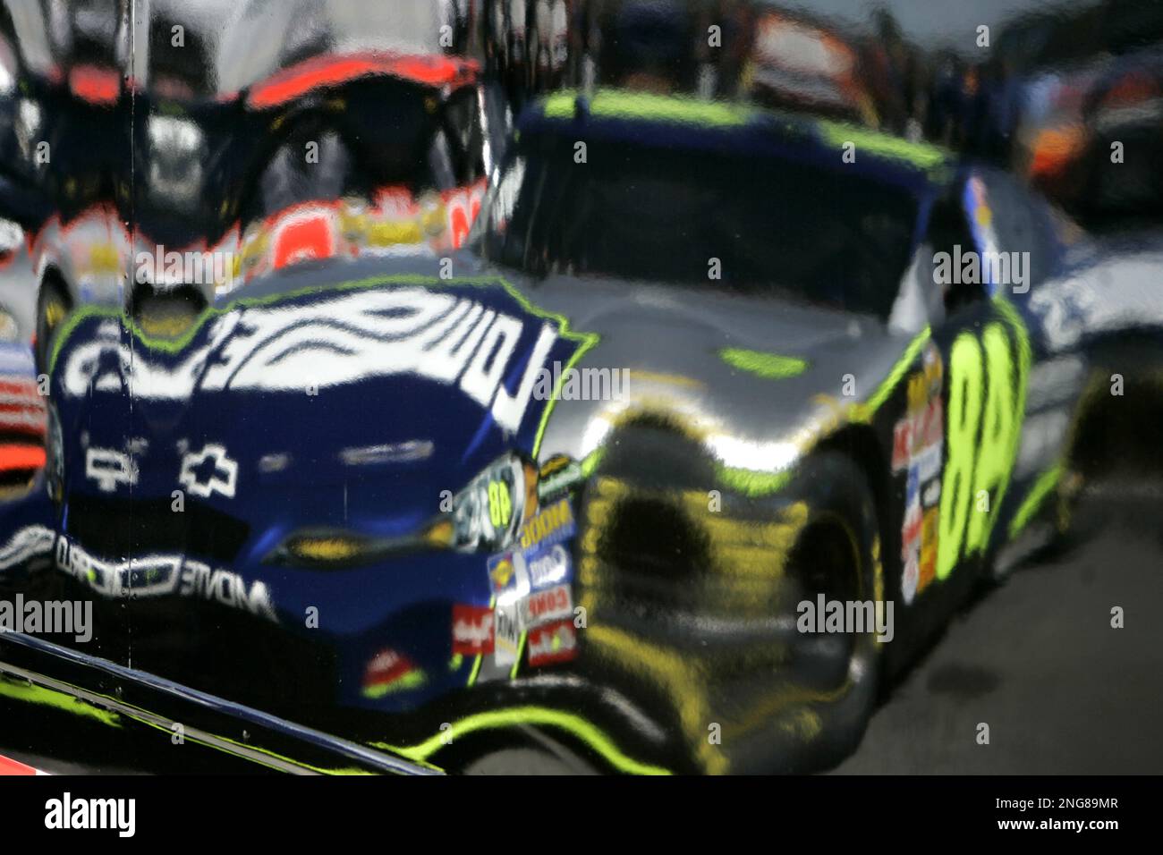 NASCAR driver Jimmie Johnson's race car is reflected in a trailer ...