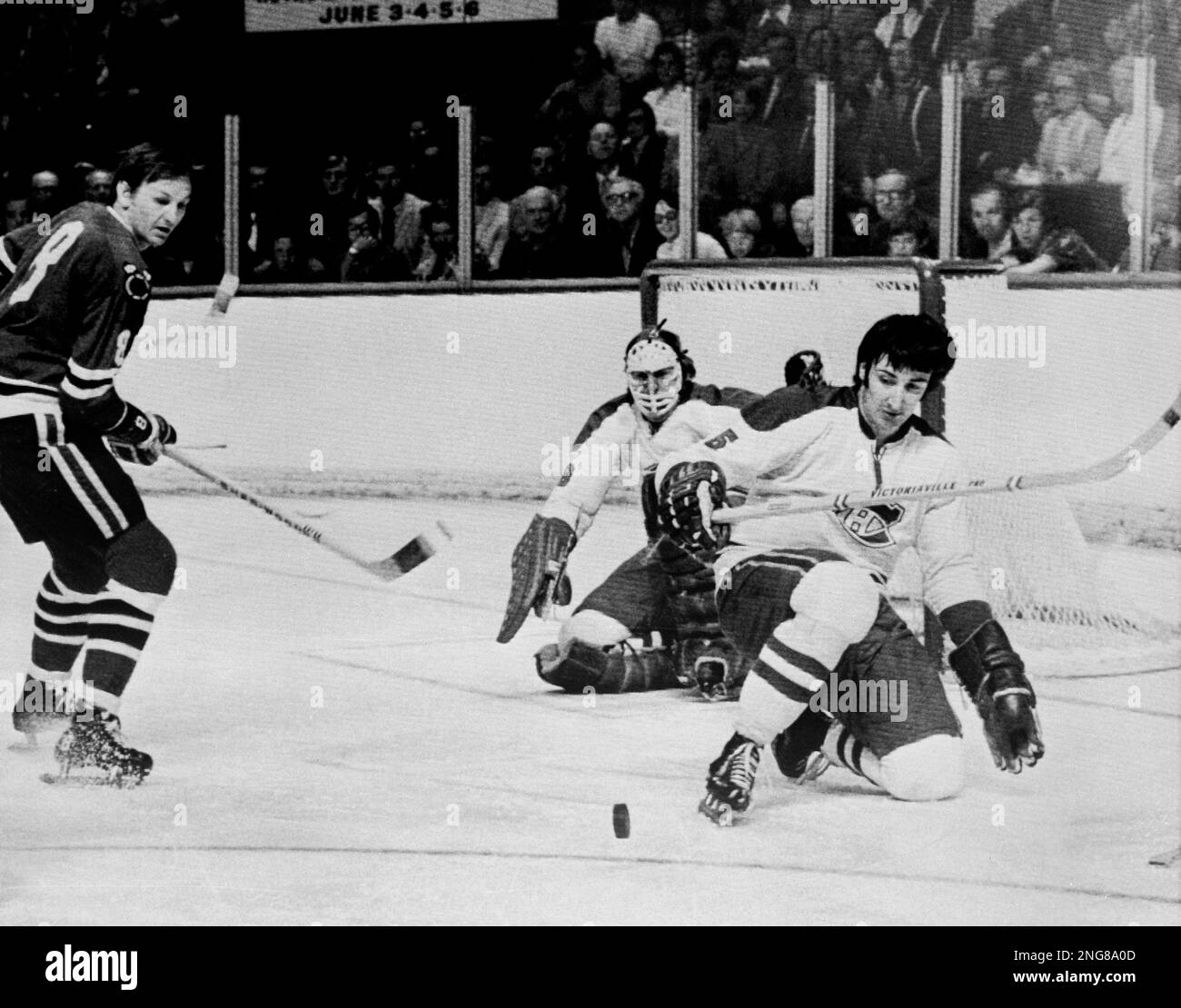 Montreal Canadiens' Guy LaPointe manages to stave a shot from Black ...