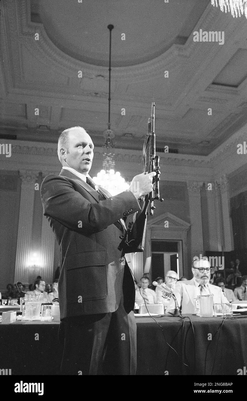 Monty C. Lutz, ballistics specialist displays the Mannlicher-Carcano ...