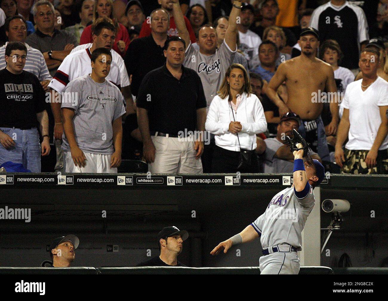 Texas Rangers third baseman Hank Blalock catches the ball hit by ...