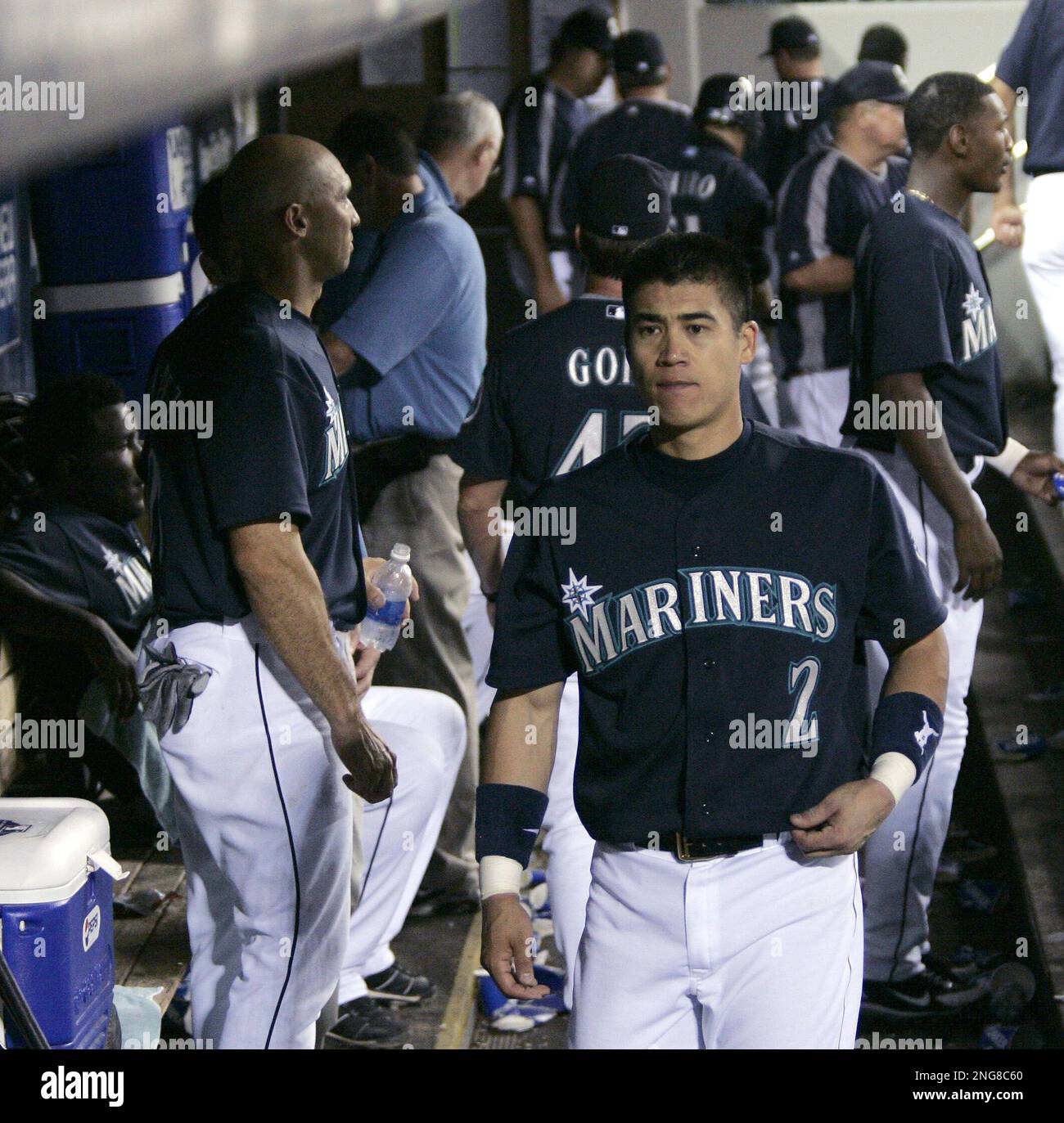 Seattle Mariners catcher Kenji Johjima walks through the home dugout ...