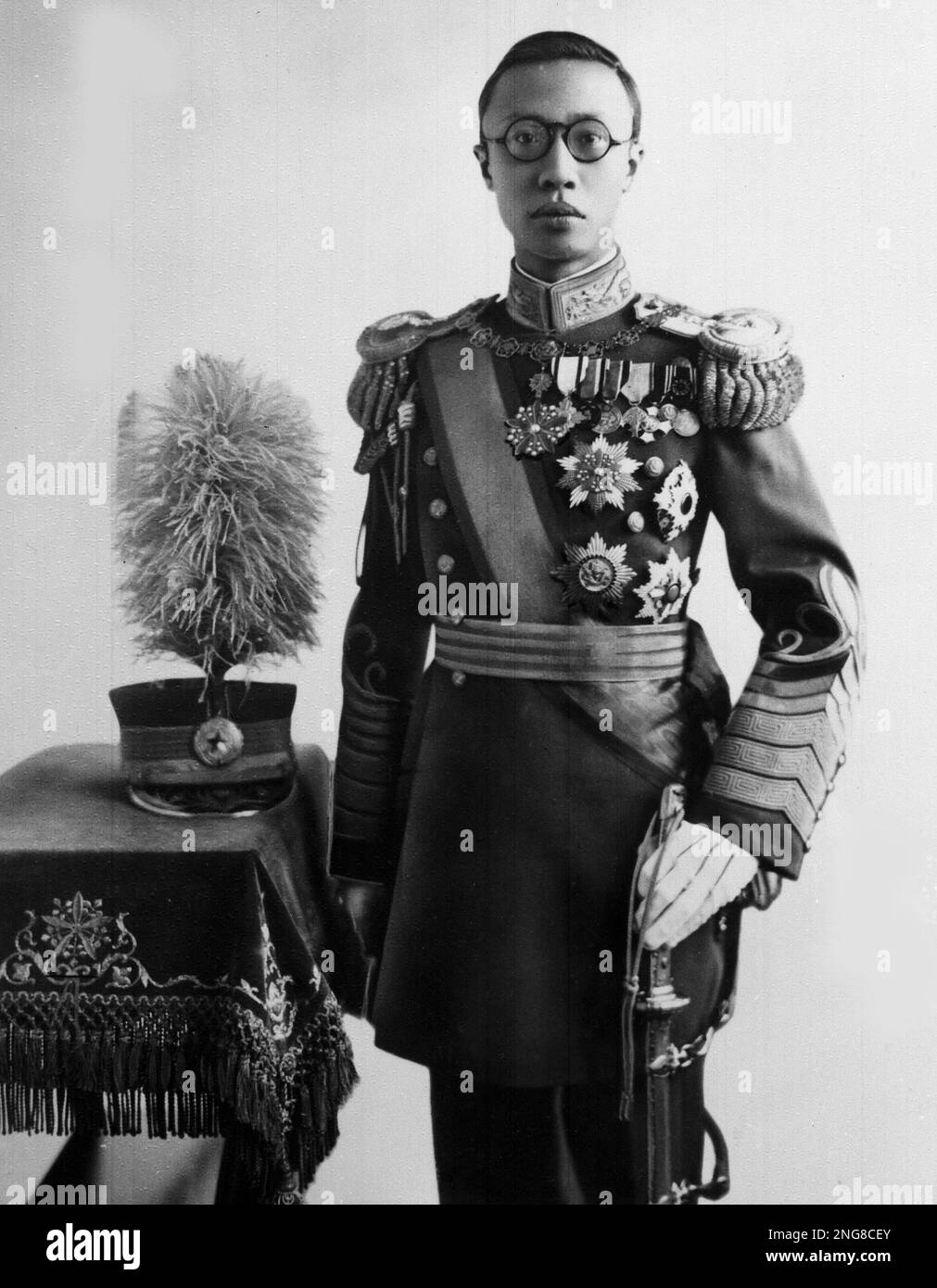 Henry Pu-Yi, former child emperor of China, is shown wearing the ...