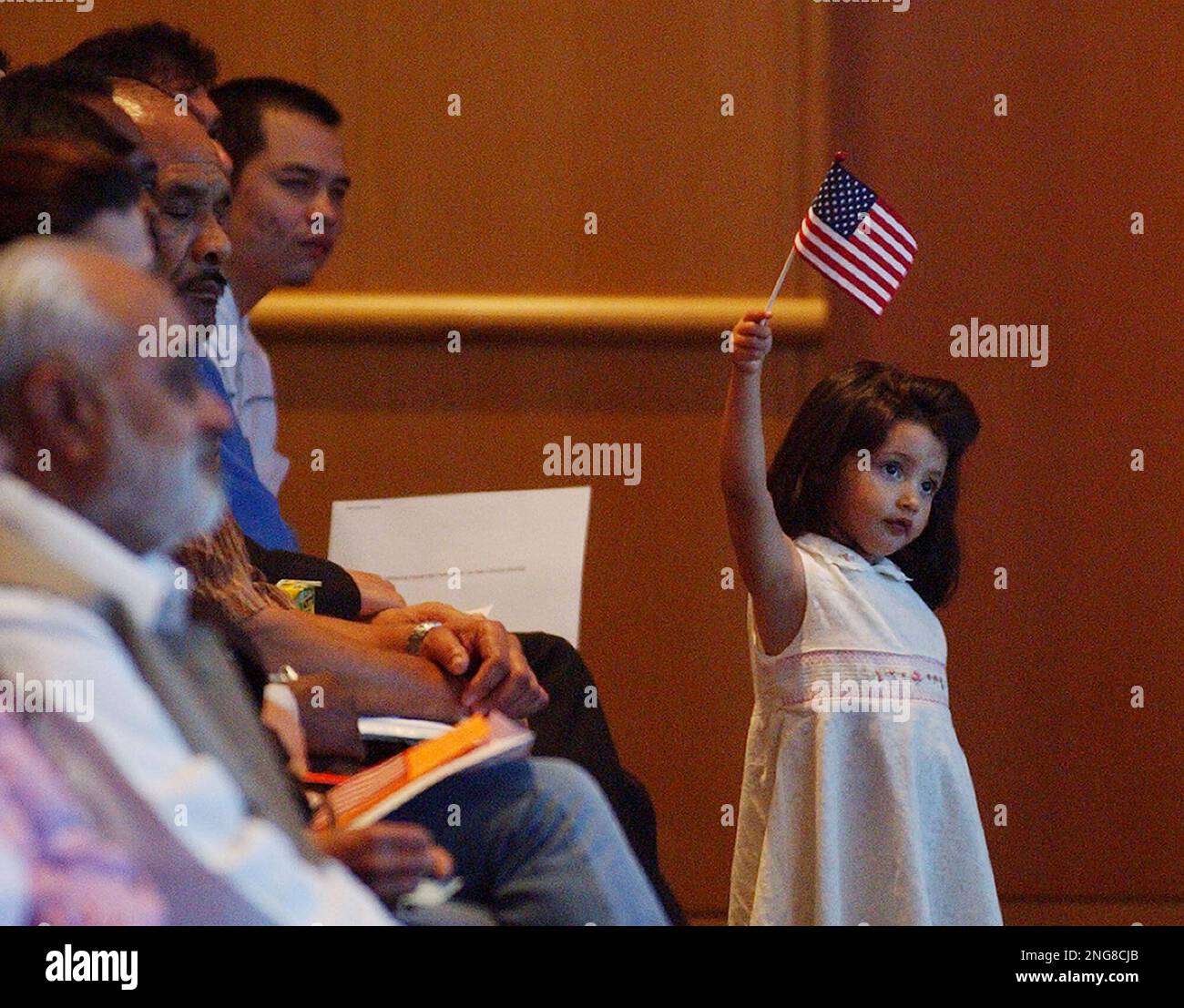 Citizen Alexandra Kolb, 3, of Haverhill, Mass., waves the U.S. flag ...