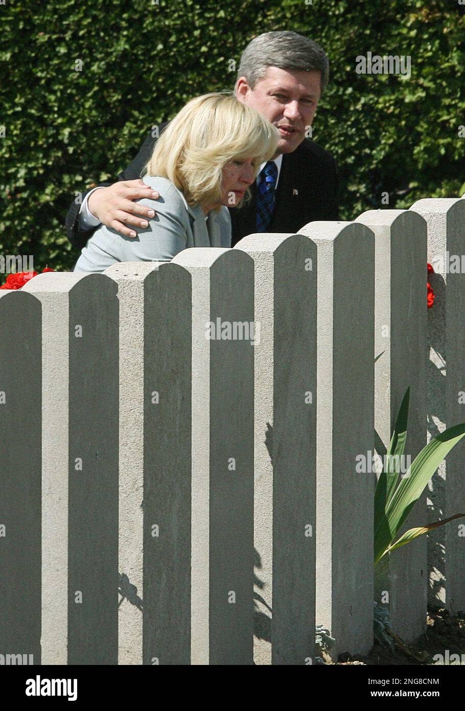 Canada's Prime Minister Stephen Harper comforts his wife Laureen as ...