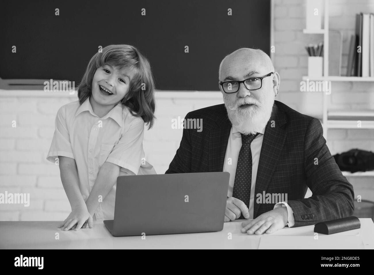 Teacher and pupil in classroom. Education concept. School learning ...