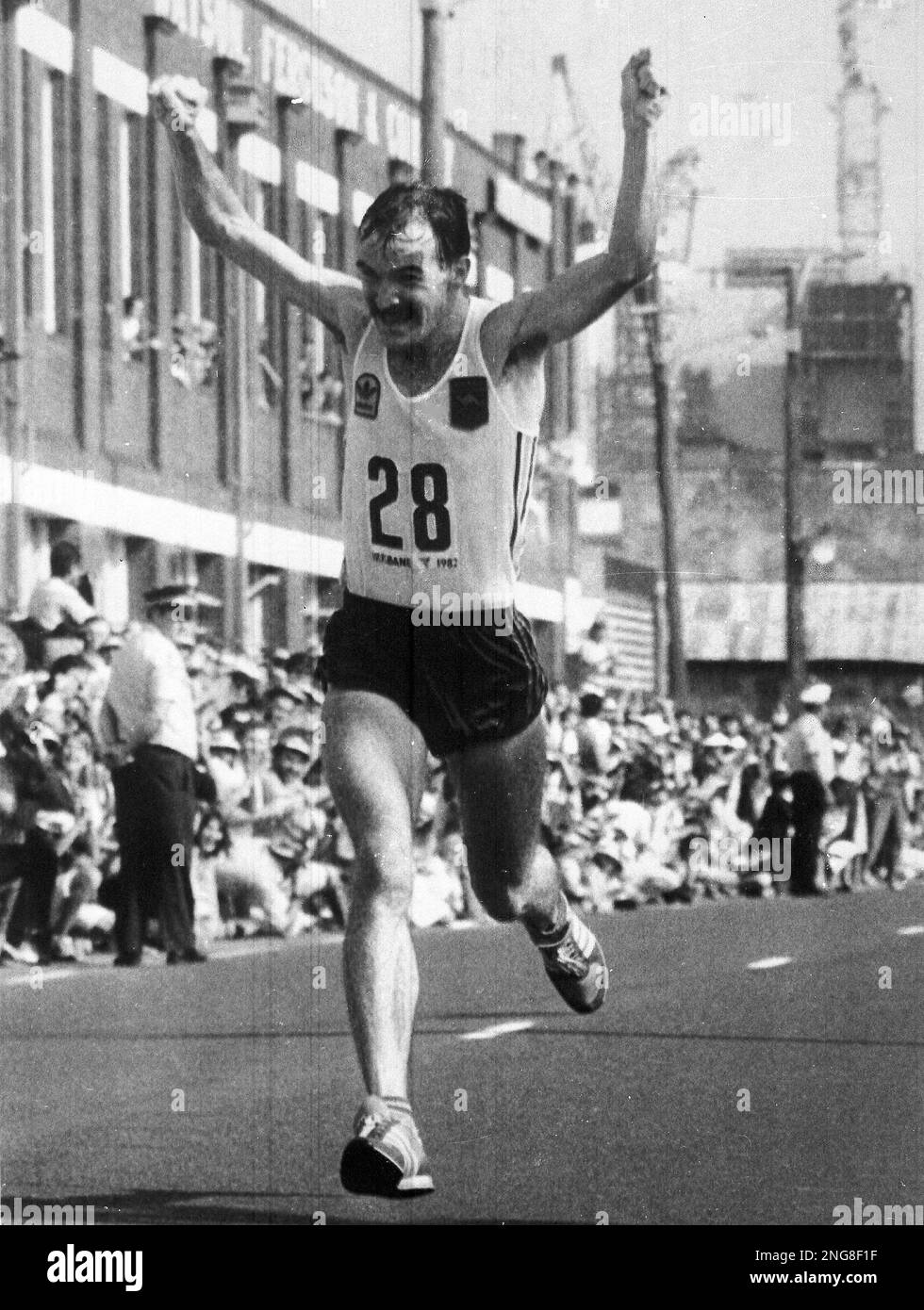 Australia's Robert De Castella races over the finishing line to clinch ...