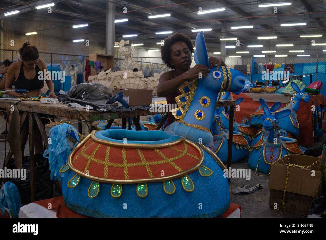 Rio De Janeiro, Brazil. 16th Feb, 2023. A woman works on a horse before ...