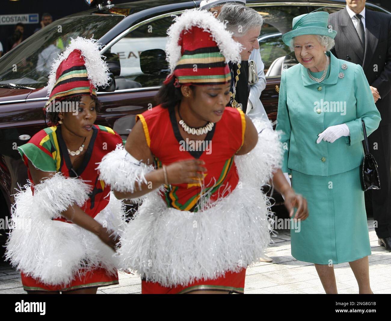 Britain's Queen Elizabeth II, right, watches traditional dancers ...