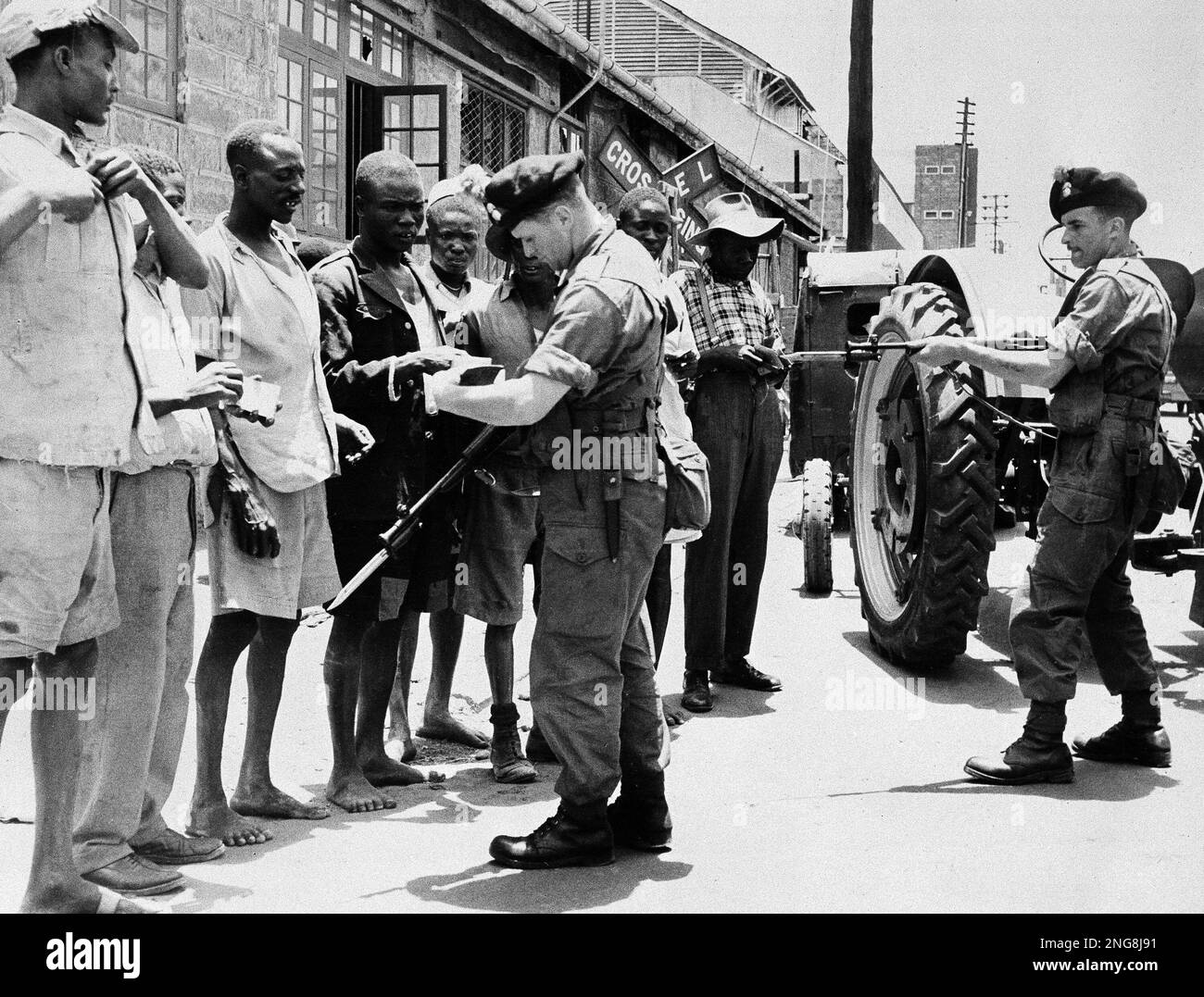 Soldiers of Britain's Royal Inniskilling Fusiliers check the identity ...