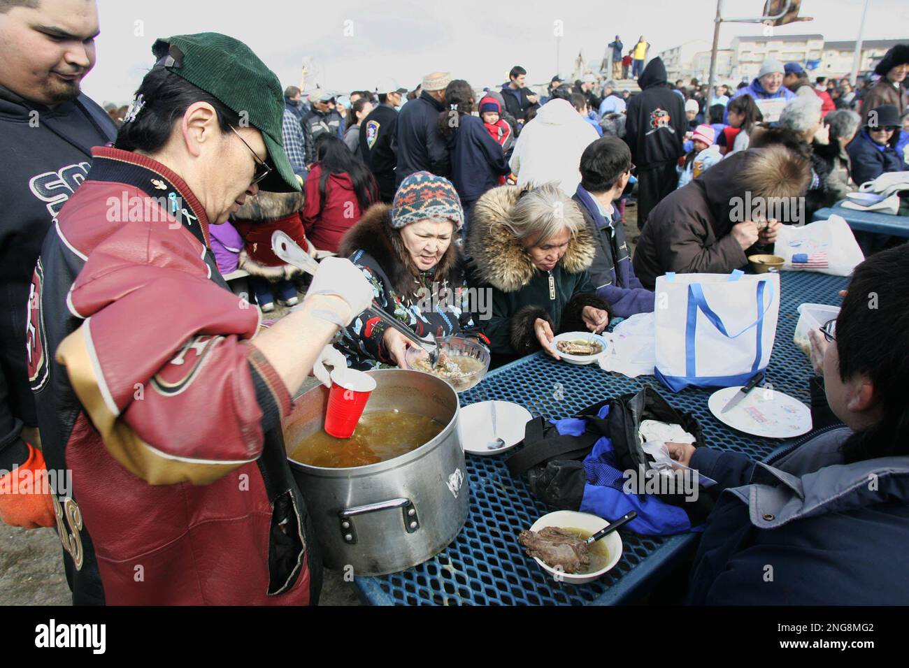 Stan Riley, left, and his mother, Louisa Riley, dish out duck soup ...