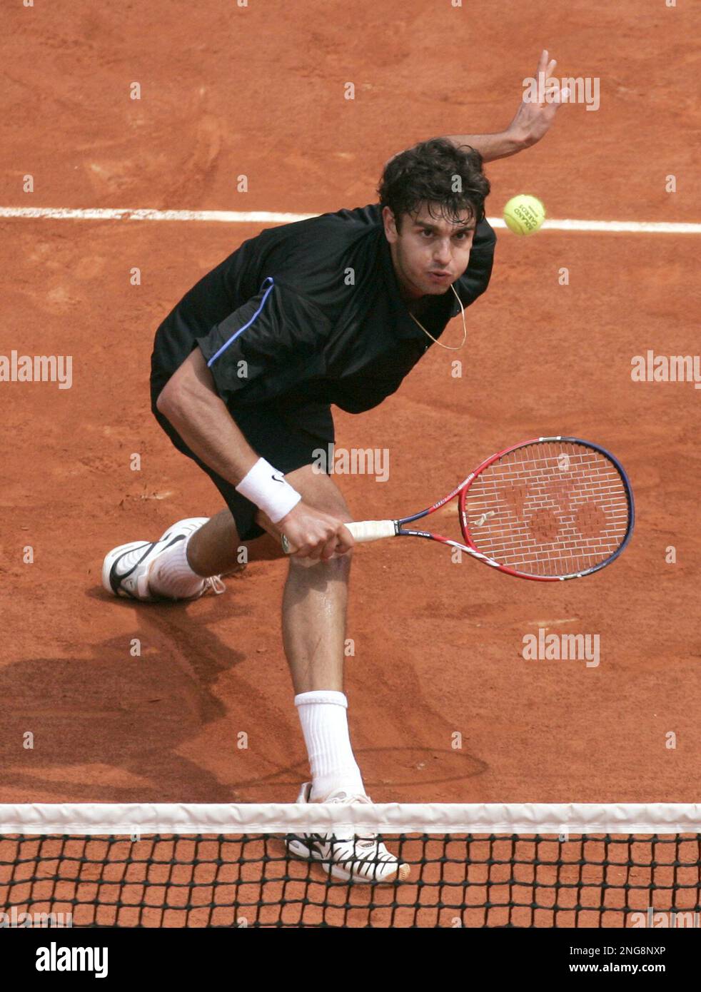 Croatia's Mario Ancic eyes the ball as he plays Spain's Tommy Robredo ...