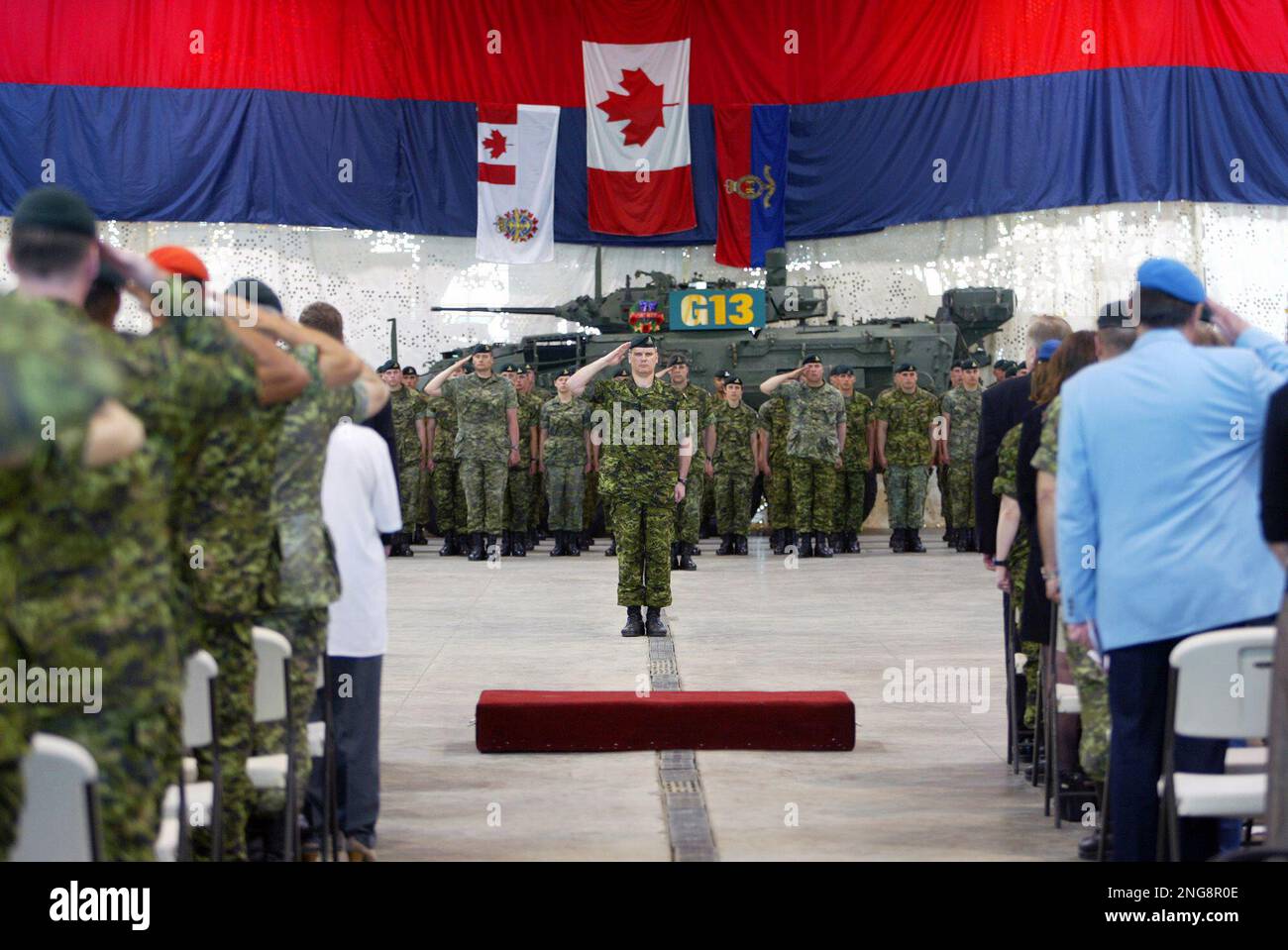 Members of the First Royal Canadian Horse Artillery stand at attention ...