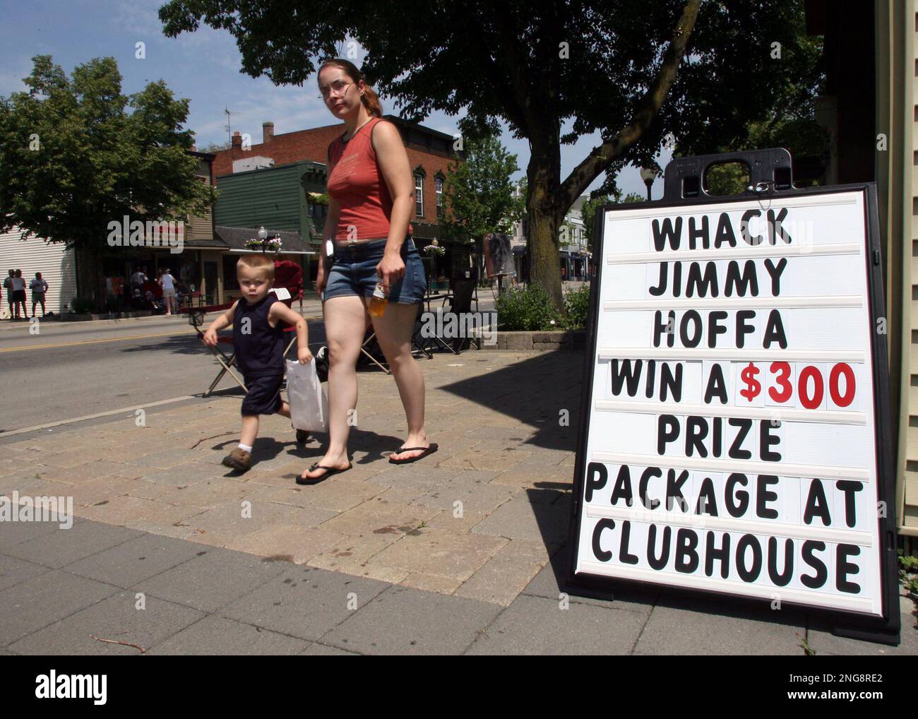Jolene Johnson, 22, of Milford Township, Mich., walks with her three ...
