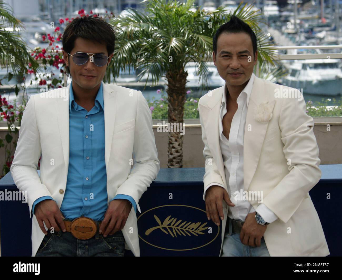 Chinese actors Louis Koo, left, and Simon Yam pose during a photo call ...
