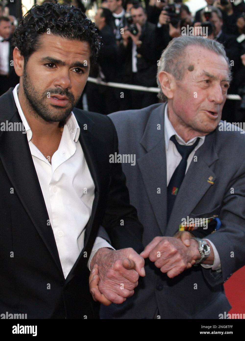 French actor Jamel Debbouze, left, arrives with an unidentified World ...