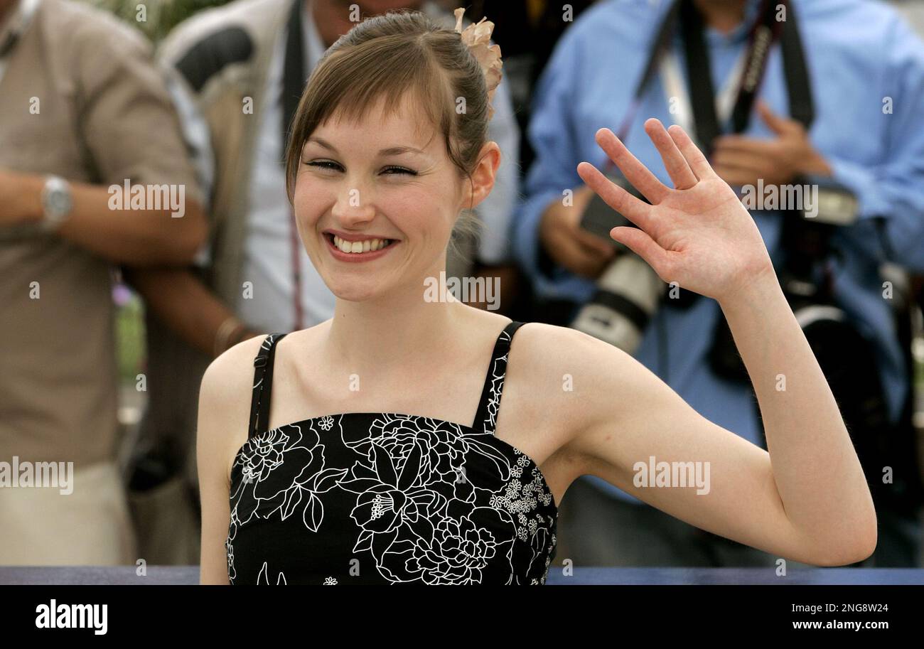 Actress Adelaide Leroux waves at a photo call for the film "Flandres ...