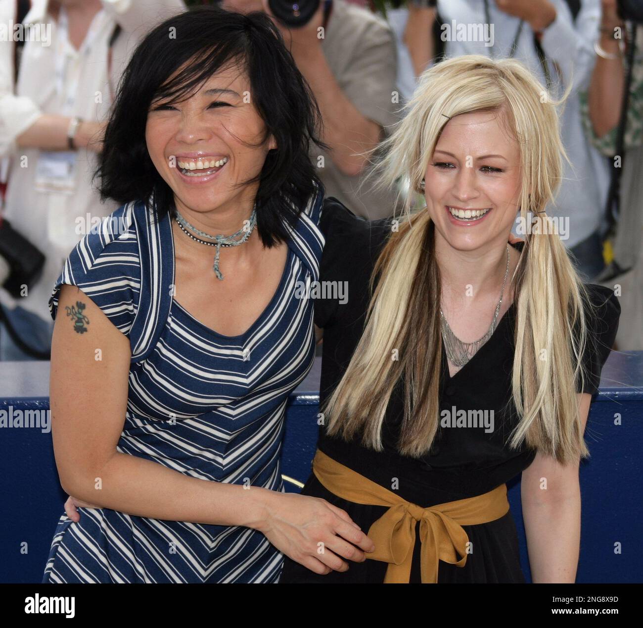 Actresses Lindsay Beamish, right, and Sook-Yin Lee pose for photographers during a photo call ...