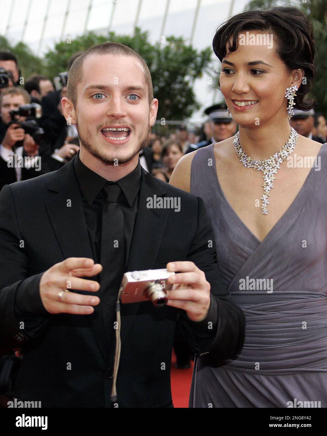 American actor Elijah Wood, left, and Pamela Racine arrive for the ...