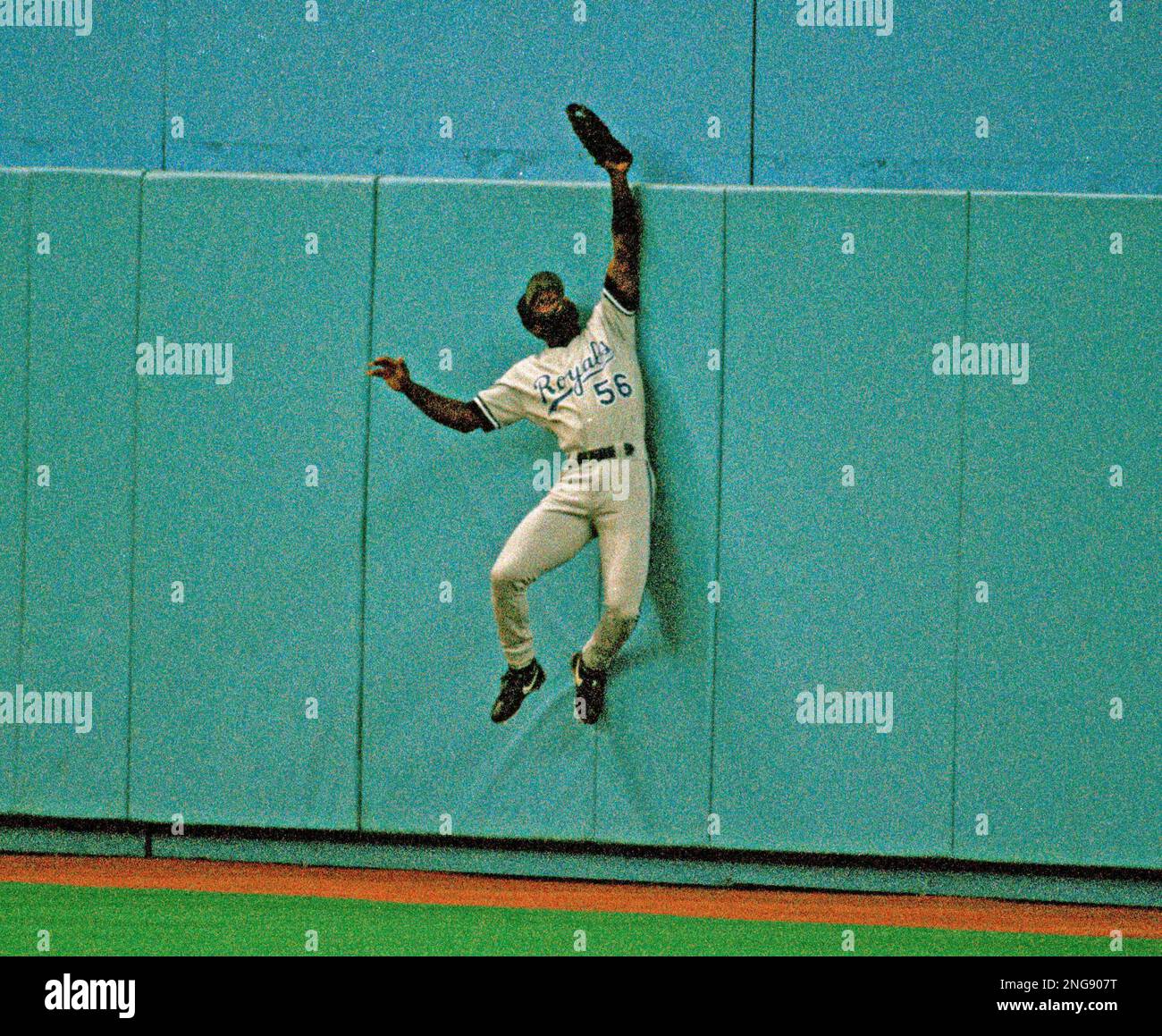 Center-fielder Brian McRae, of the Kansas City Royals, leaps to make ...