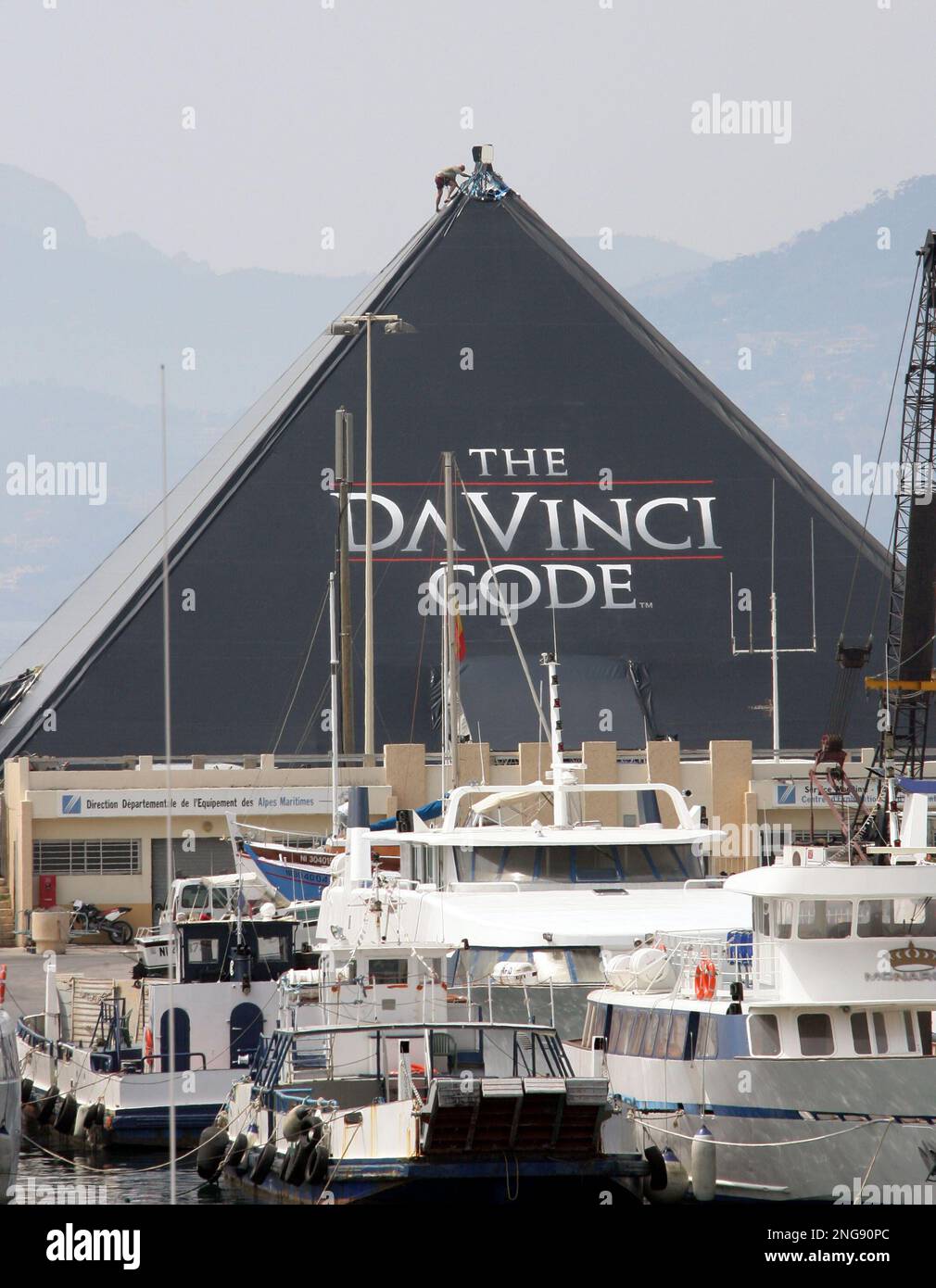 A pyramid shaped tent advertising 'The Da Vinci Code' is located on the ...