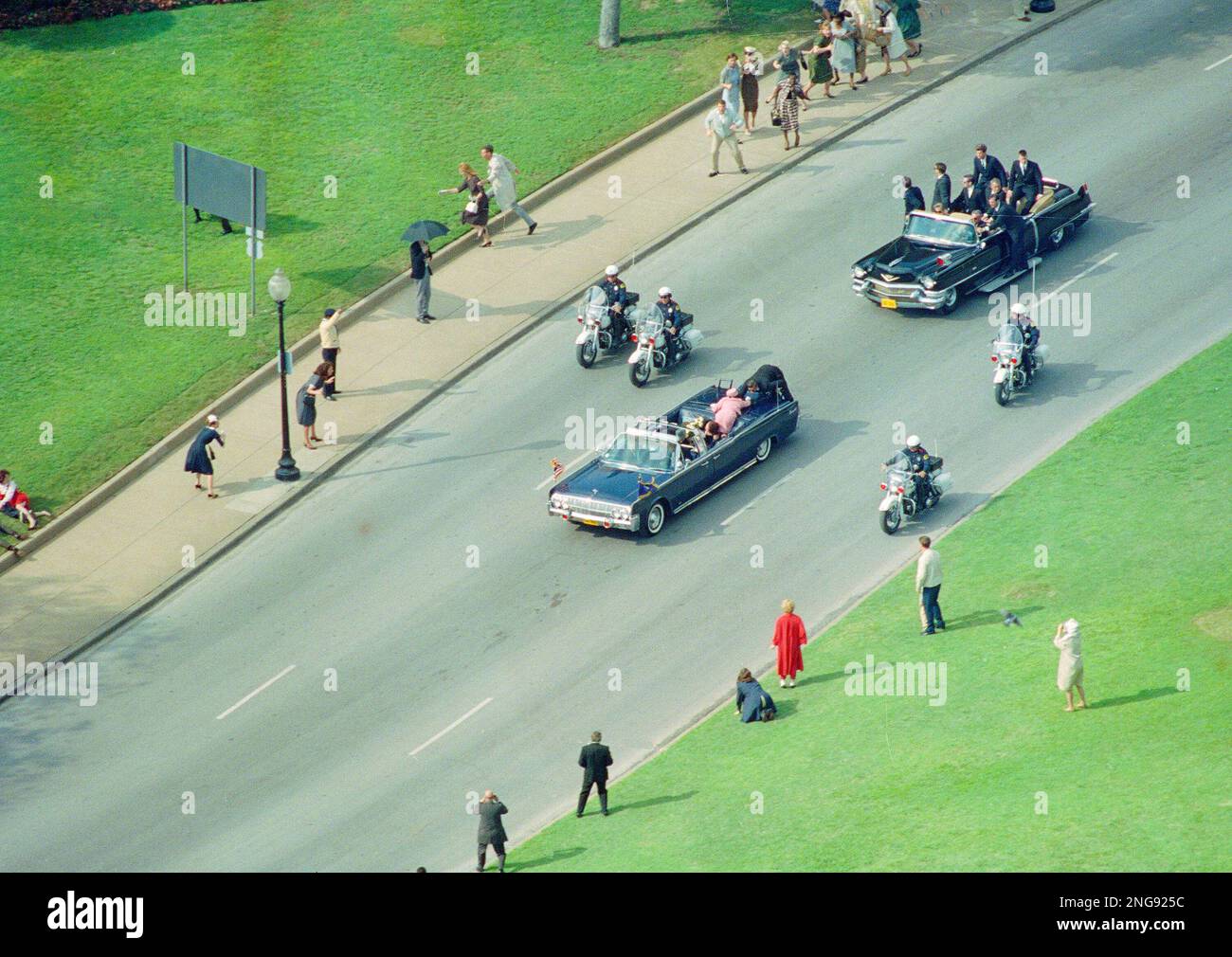 A reenactment of the parade with President Kennedy movies down Elm ...