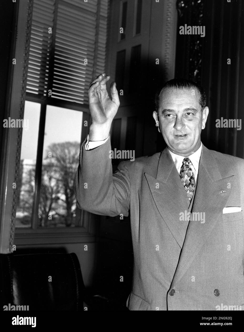 Sen. Lyndon B. Johnson waves outside the senate chamber in Washington ...