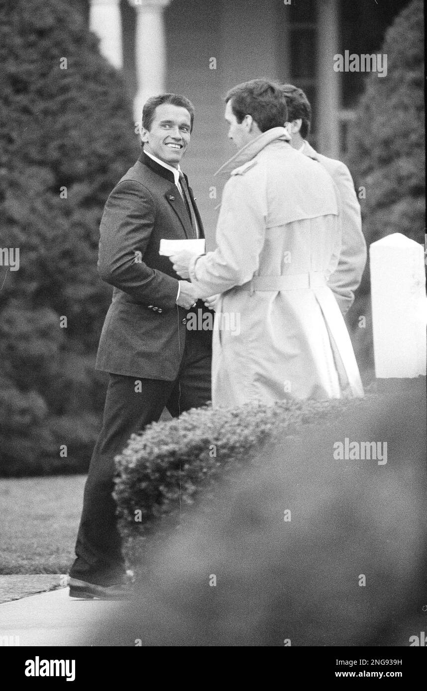 Actor and bodybuilder Arnold Schwarzenegger smiles back at the crowd ...