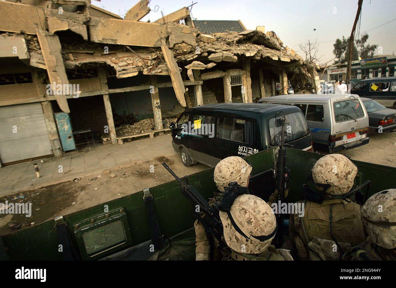 U.S. Marines ride in the open back of a humvee during a patrol in ...