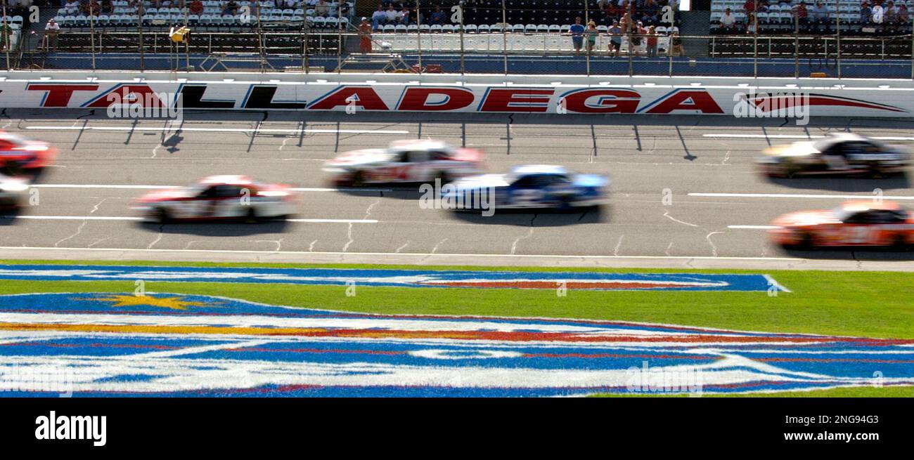 Cars go through the tri-oval Friday, April 28, 2006, at Talladega ...