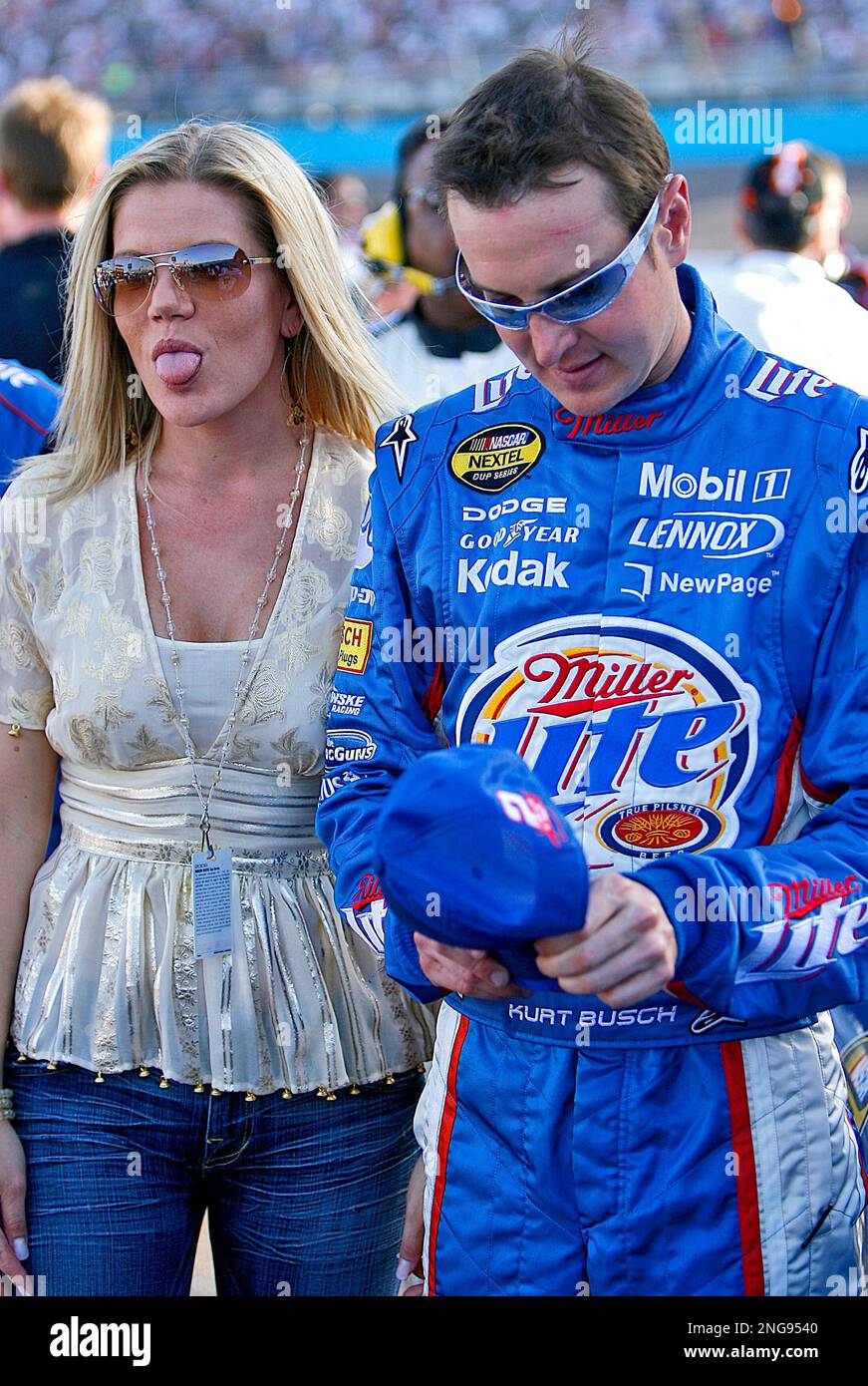 NASCAR Nextel Cup driver Kurt Busch adjusts his cap as girlfriend Eva ...