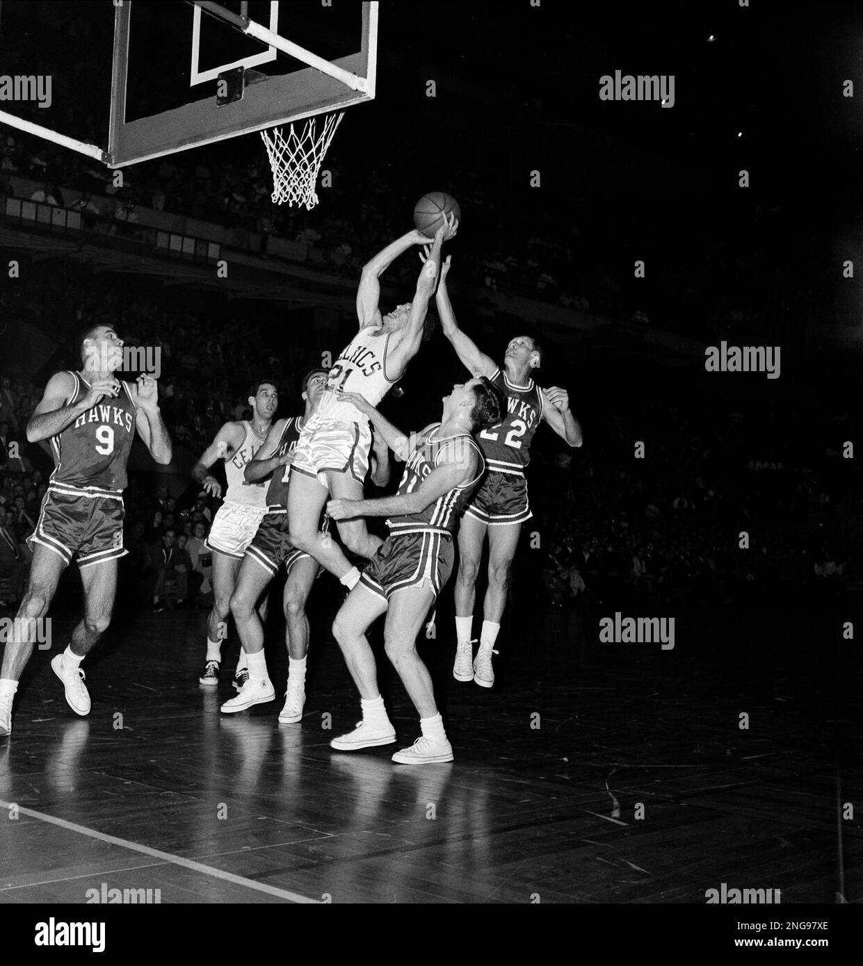 Bill Sharman, Boston Celtics' player, (21), snags a rebound from the ...