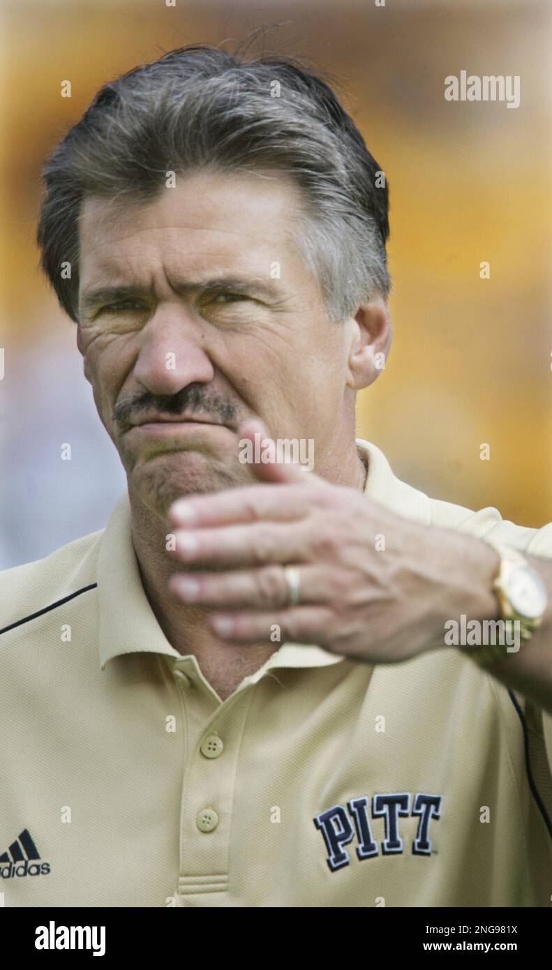 Pittsburgh head football coach Dave Wannstedt walks off the field ...