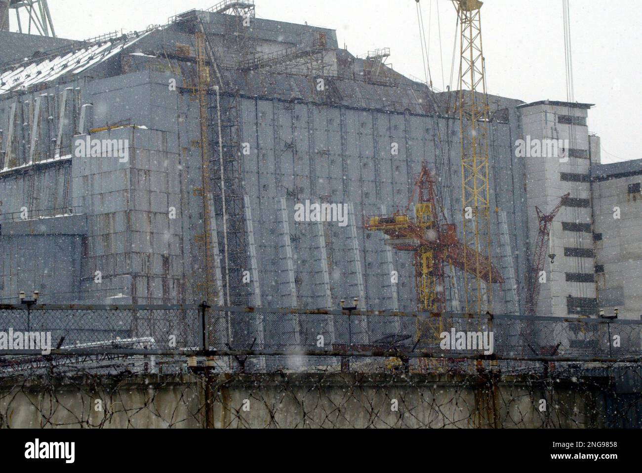 View of the gray cracked and crumbling sarcophagus covering Chernobyl ...