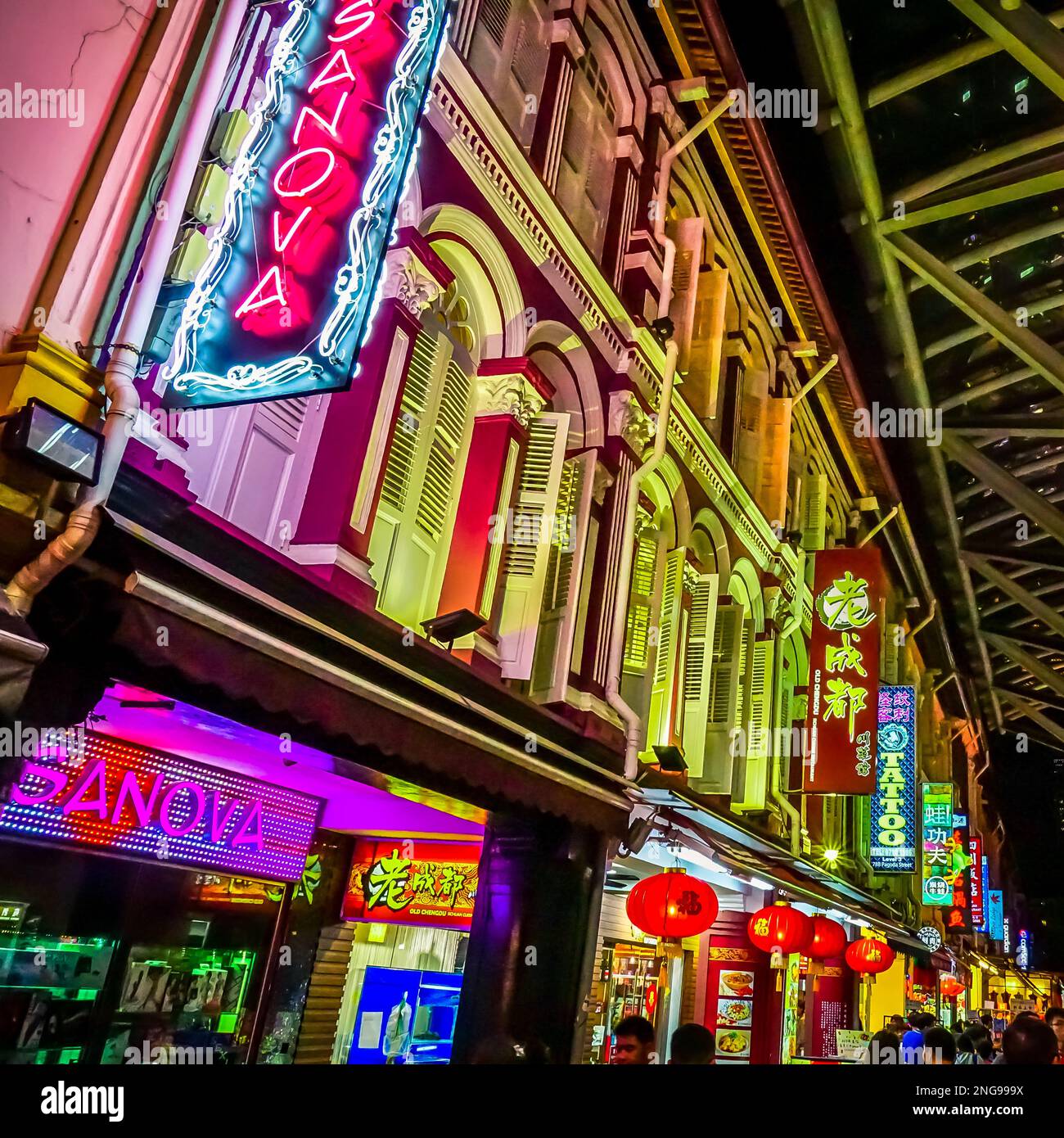 Colorful view of Chinatown shophouse restaurants at night, Singapore ...