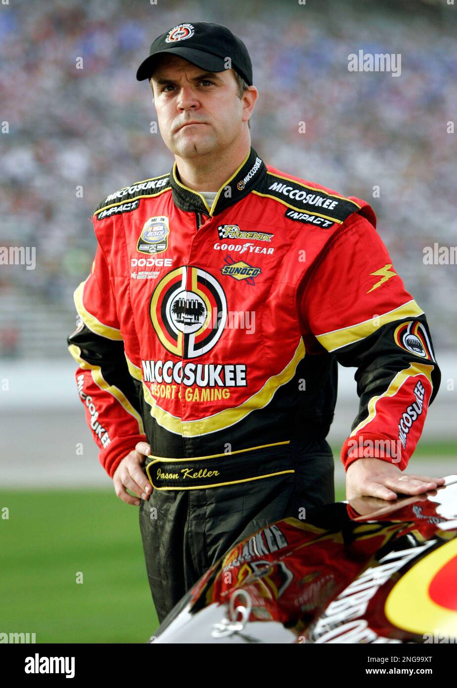 Jason Keller walks down pit road prior to qualifying for the NASCAR O ...