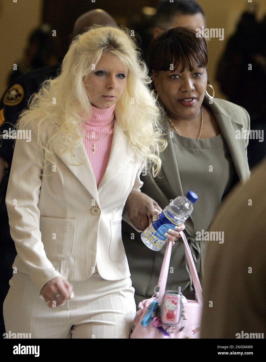 Tanya Nicole Kach, left, leaves the courtroom in Pittsburgh after a ...