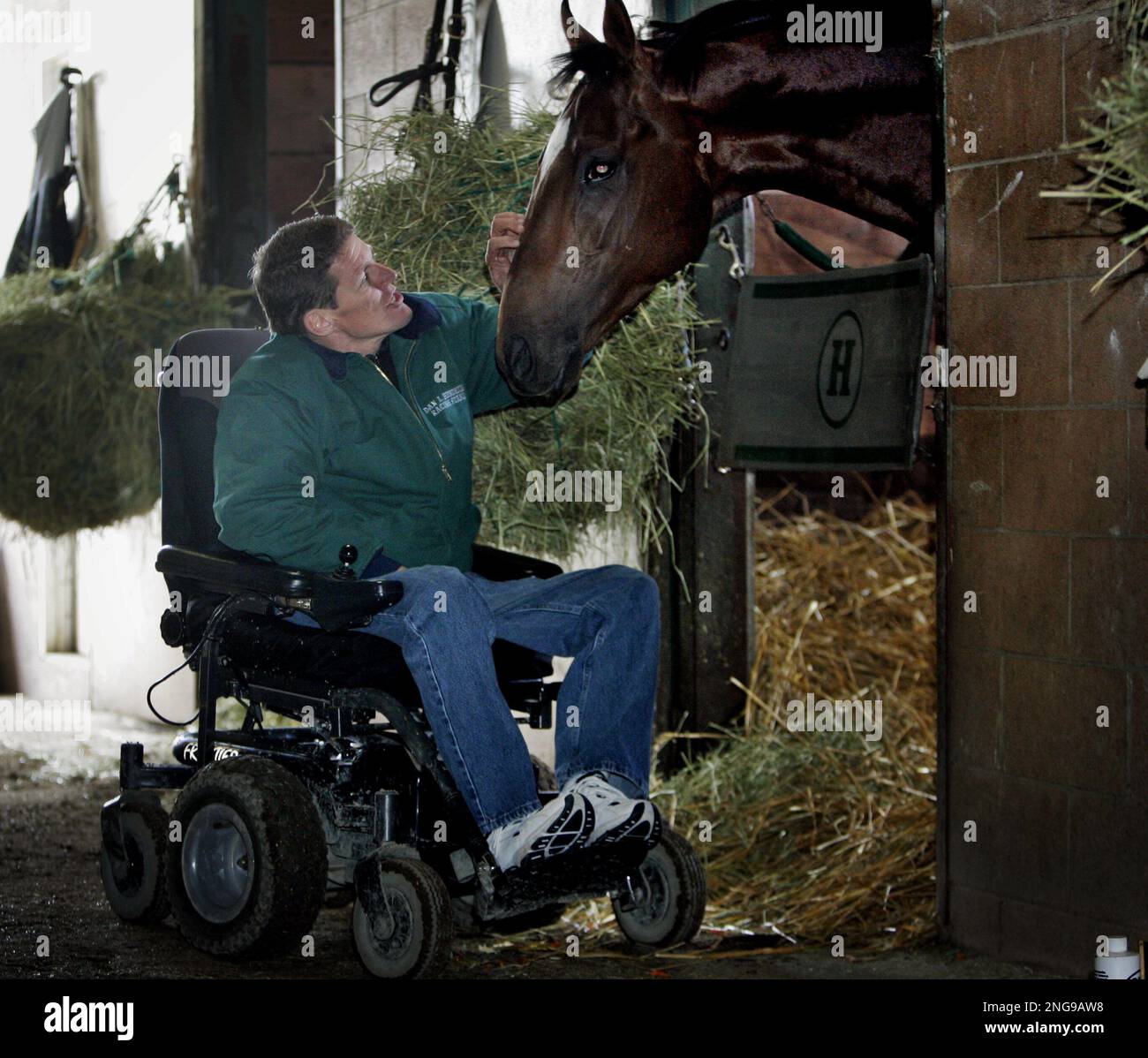 Trainer Dan Hendricks sits with his horse Brother Derek, a 3-year-old ...