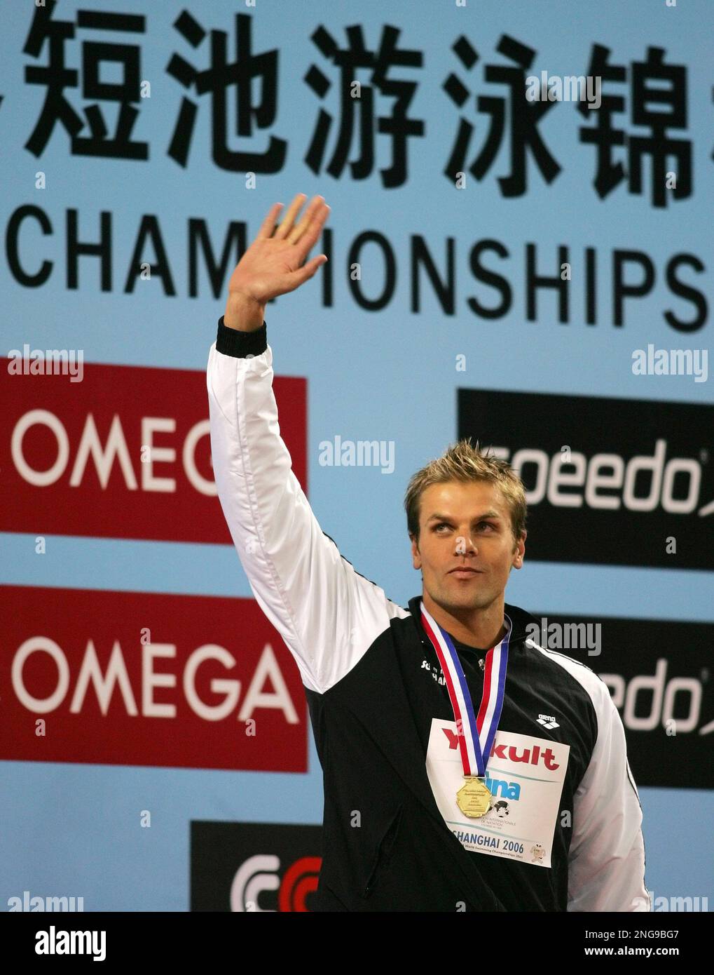 South Africa's Ryk Neethling celebrates on the podium after his win in ...