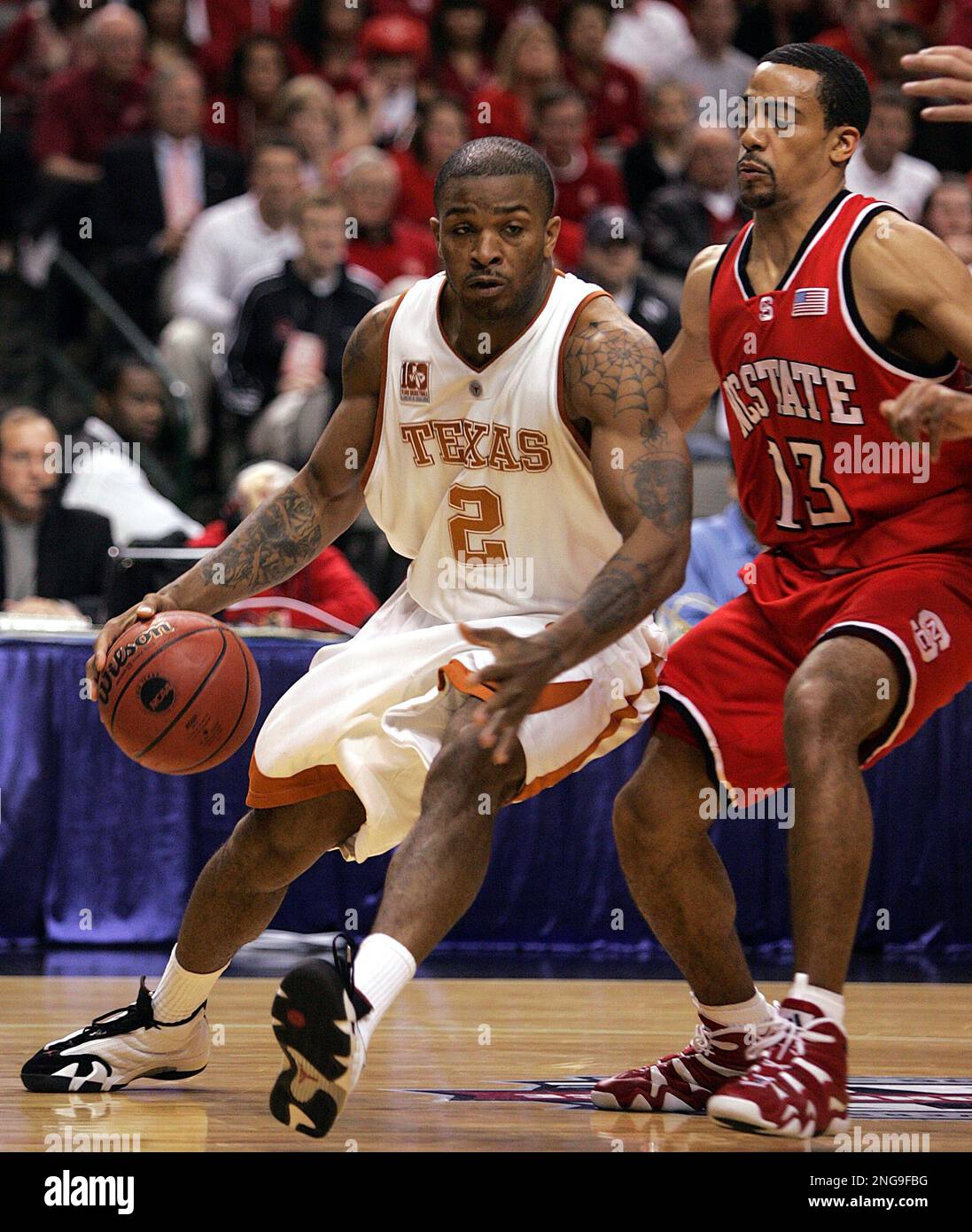 Texas forward P. J. Tucker (2) works the ball around North Carolina ...