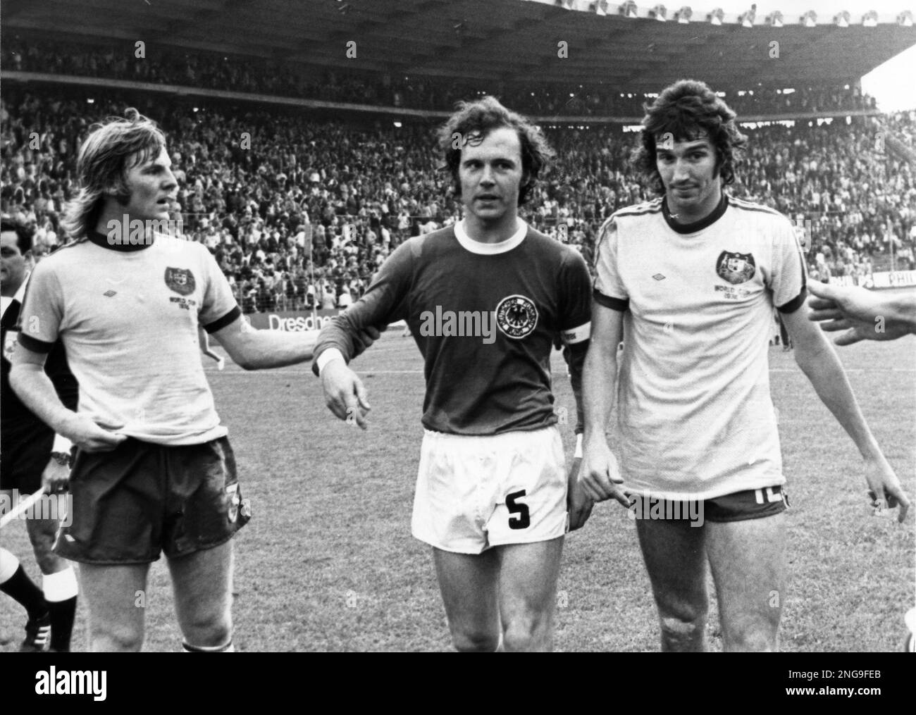 West German team captain Franz Beckenbauer, center, leaves the pitch ...