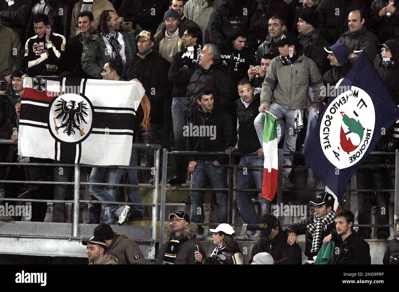 Juventus' supporters show a Nazi flag, left, and the Italian Social ...